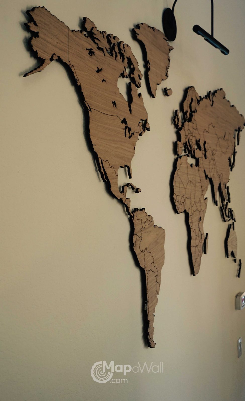 Oak wooden world map in the spotlight | Woodenworldmap.com
